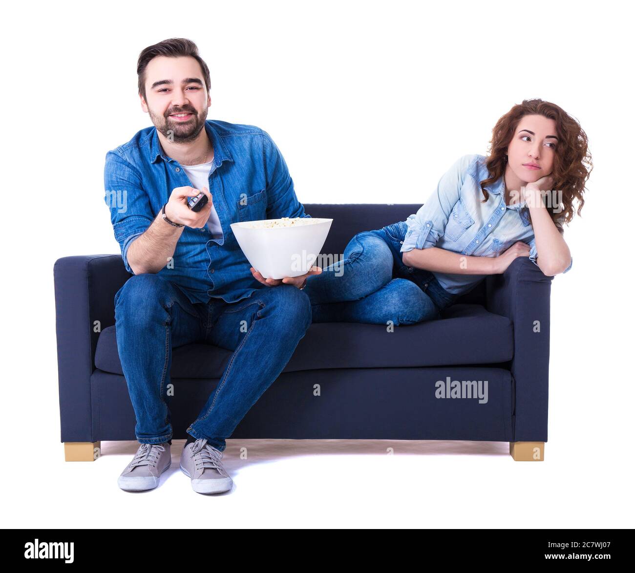 woman being bored watching tv with boyfriend isolated on white ...