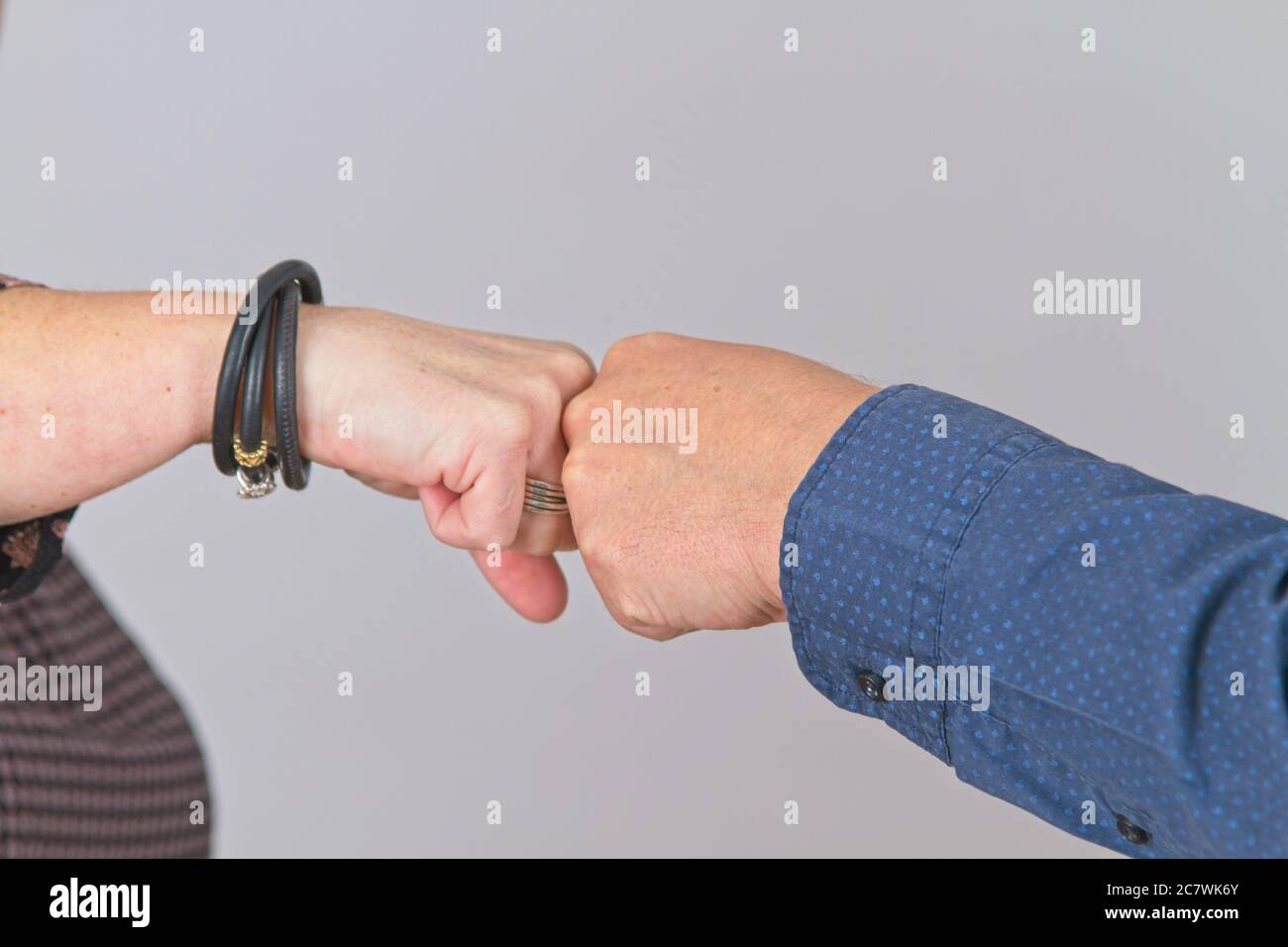 People's hands greeting each other with knots Stock Photo - Alamy