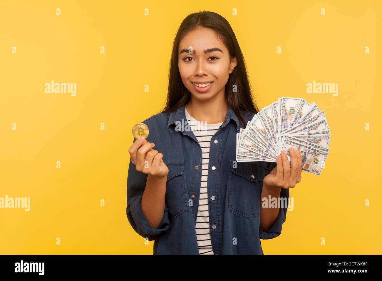 Cryptocurrency btc and money. Portrait of rich happy brunette girl in ...