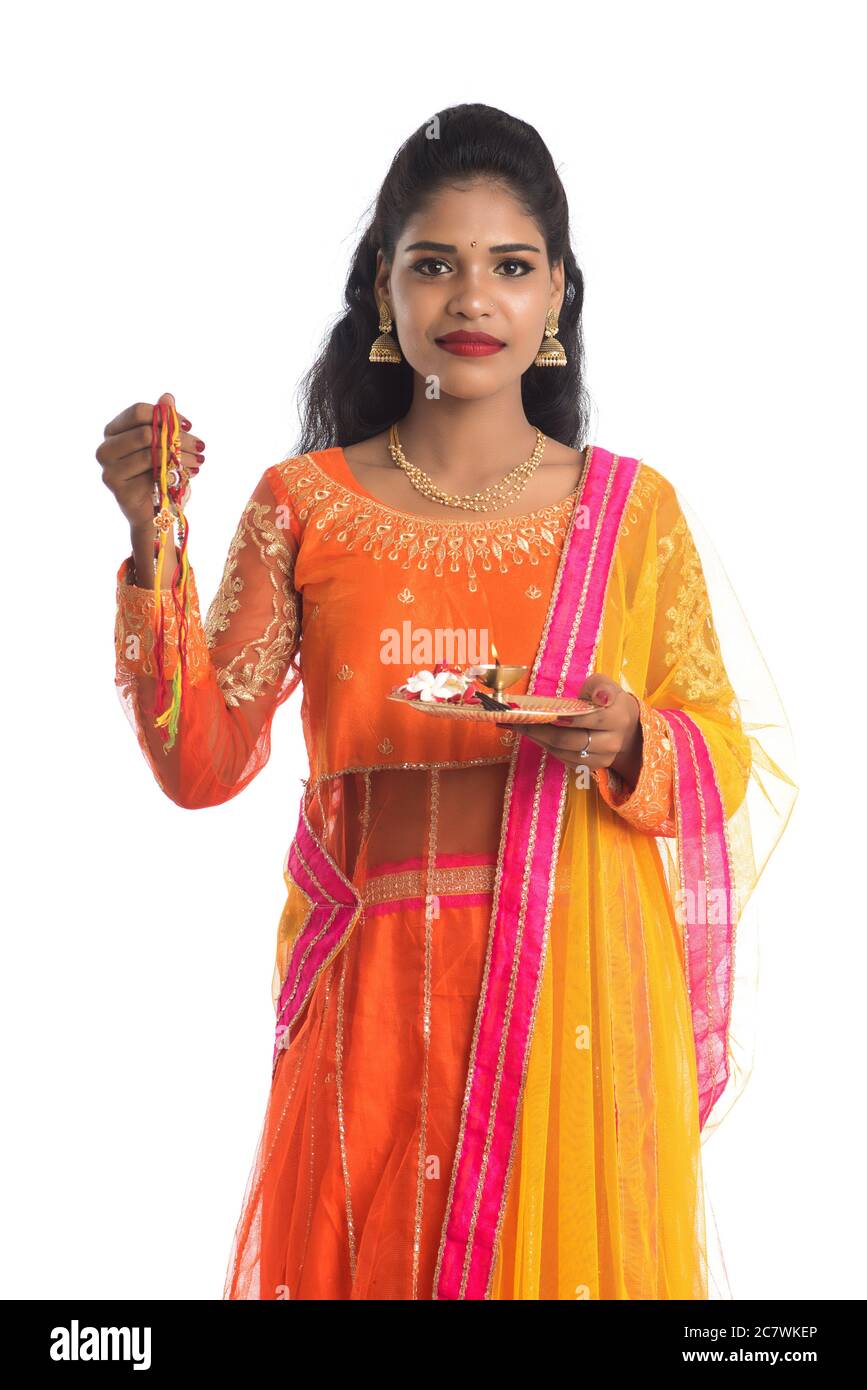 Beautiful Indian Girl Showing Rakhi With Pooja Thali On Occasion Of Raksha Bandhan Sister Tie