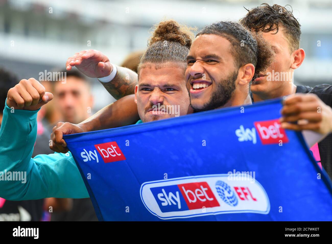 Leeds United players celebrate as they are promoted to the Premier ...