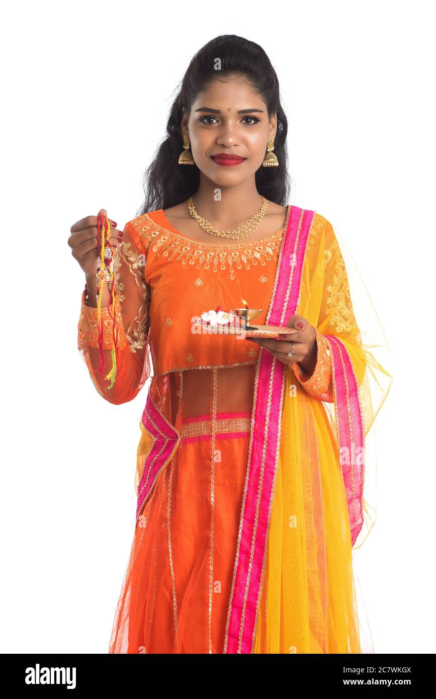 Beautiful Indian Girl Showing Rakhi With Pooja Thali On Occasion Of Raksha Bandhan Sister Tie