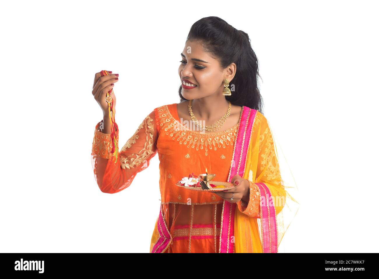 Beautiful Indian Girl Showing Rakhi With Pooja Thali On Occasion Of Raksha Bandhan Sister Tie