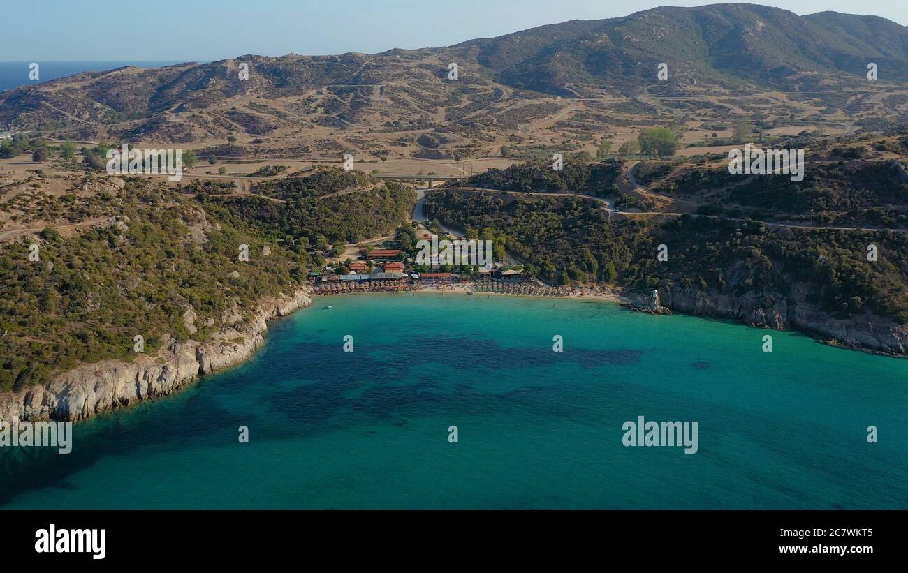 Aerial shot of a mountainous bay shore with blue waters - perfect for ...