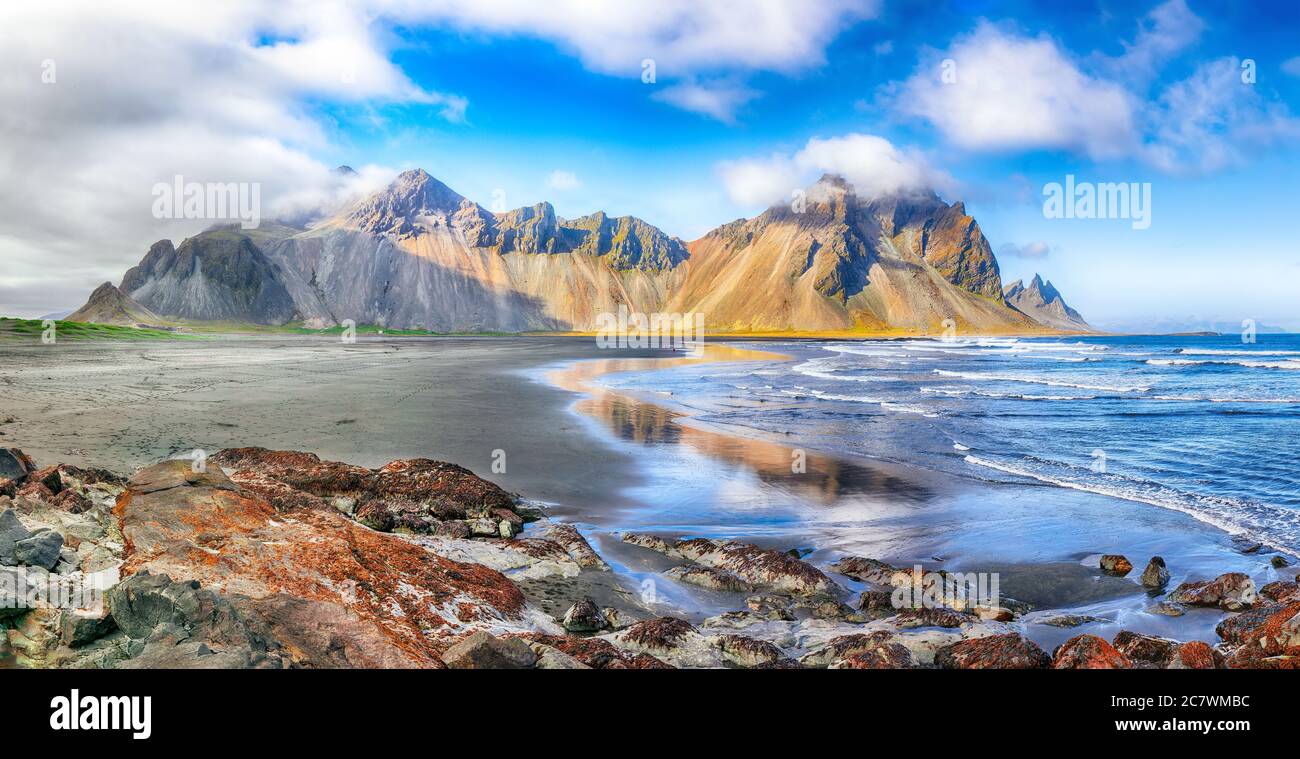 Fantastic sunny day and dramatic black sand beach on Stokksnes cape in ...
