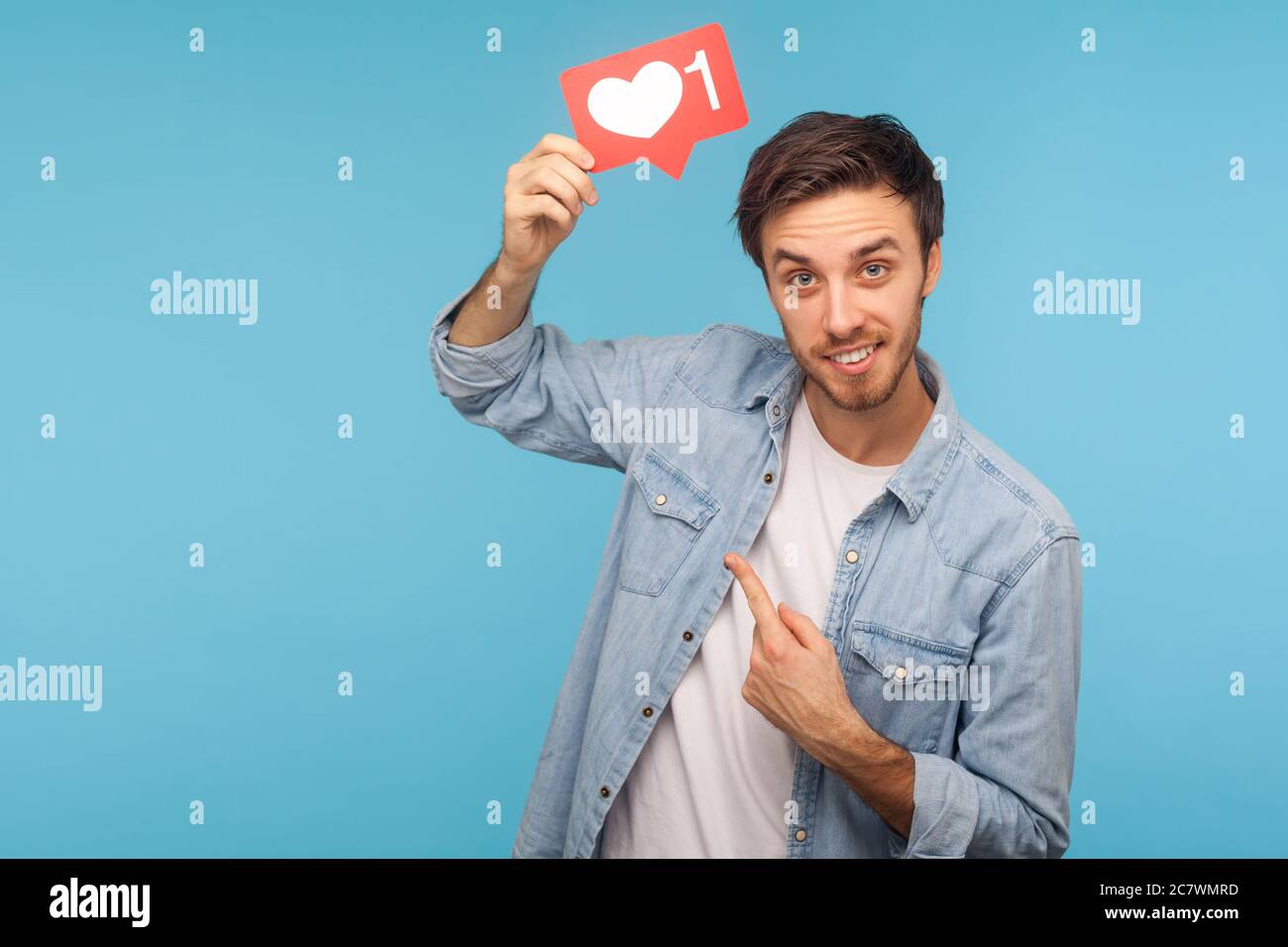 Click Like! Portrait of cheerful handsome blogger man in denim shirt ...