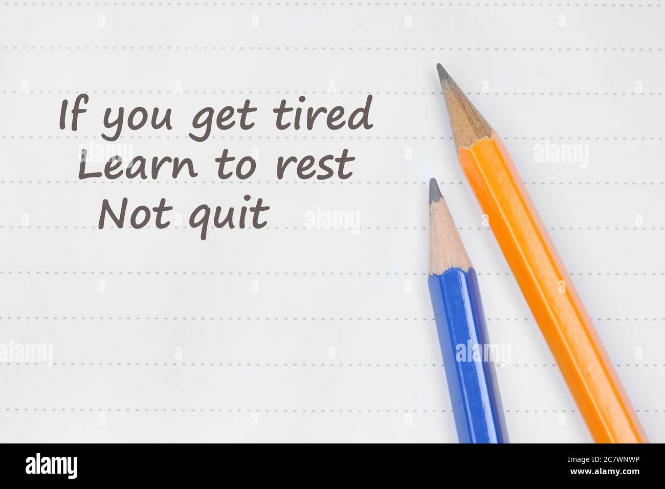 If you get tired learn to rest not quit. Inspirational quote on notepad ...