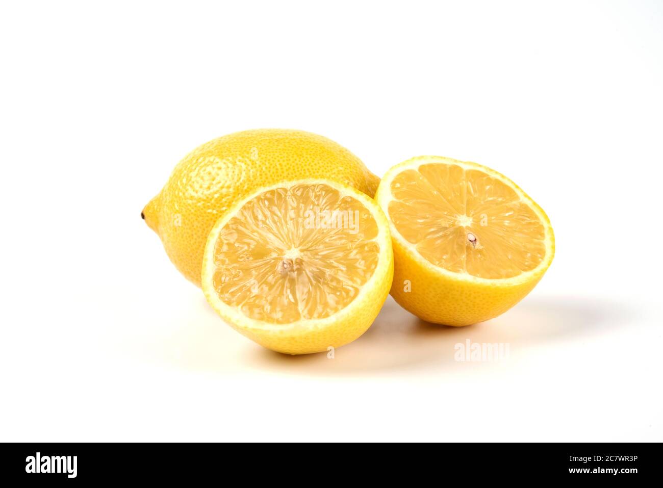 Yellow fresh lemon cut into pieces Stock Photo - Alamy