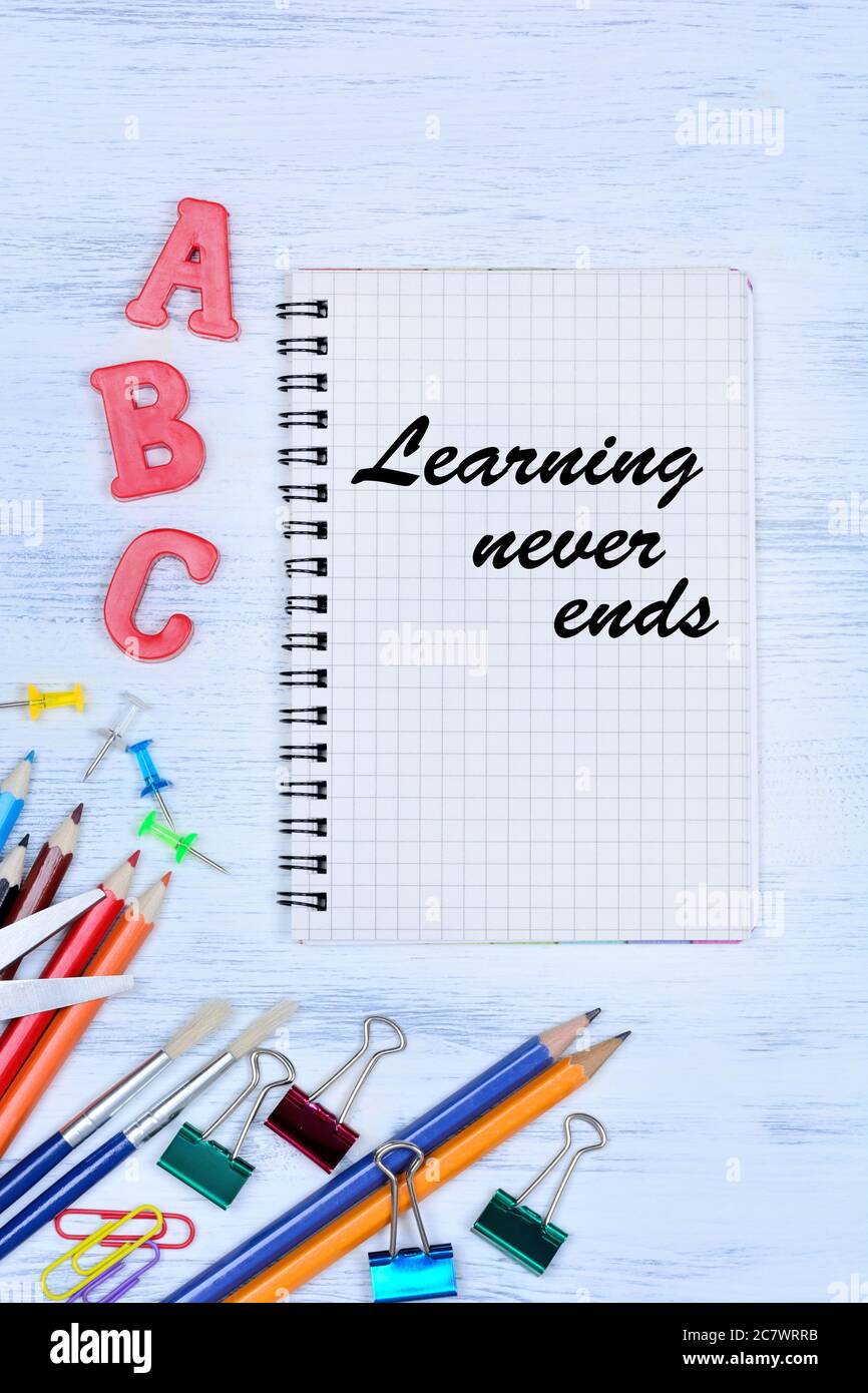 Learning never ends. Text on notebook on a desk close-up Stock Photo ...