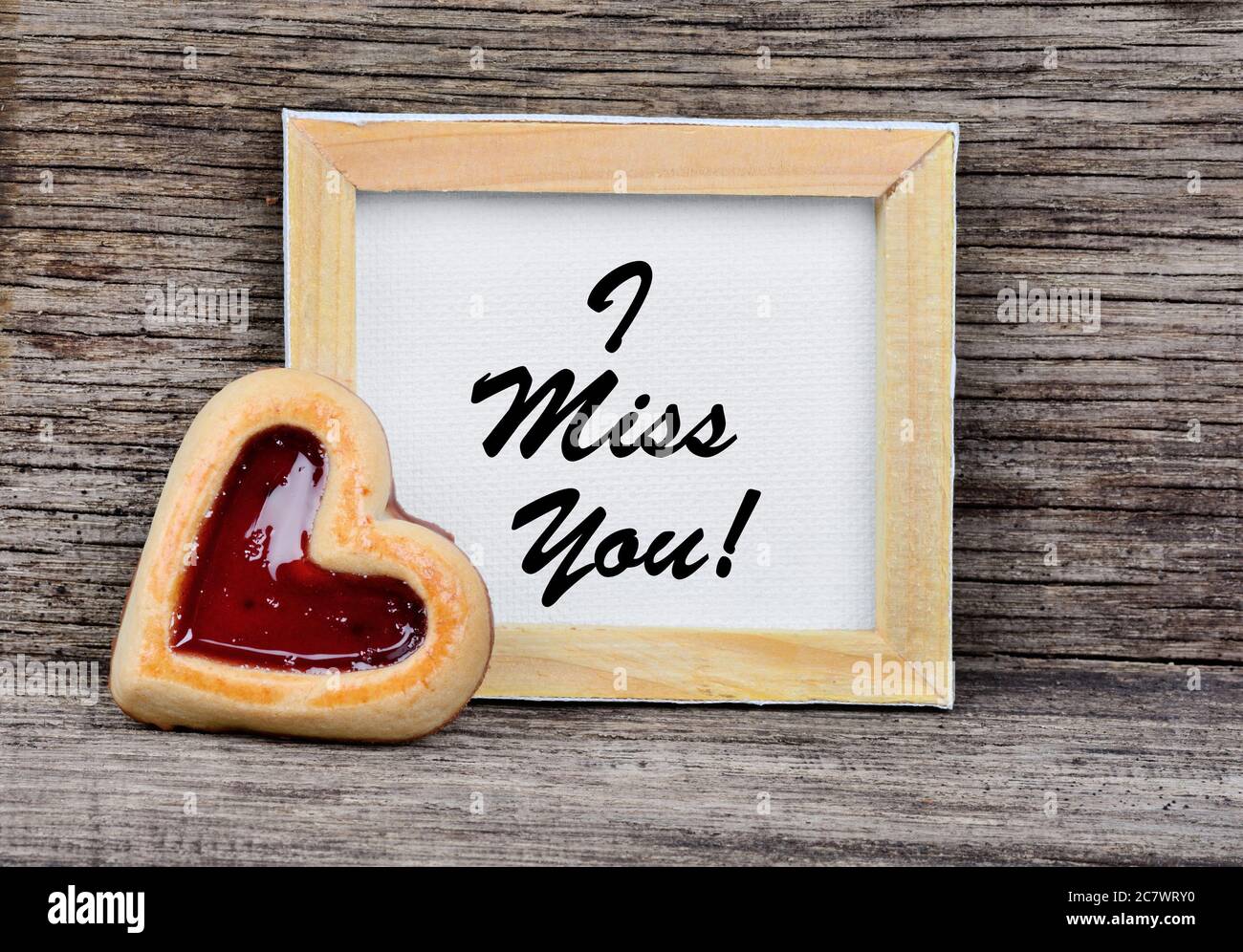 I miss you words on frame on a wooden table Stock Photo - Alamy