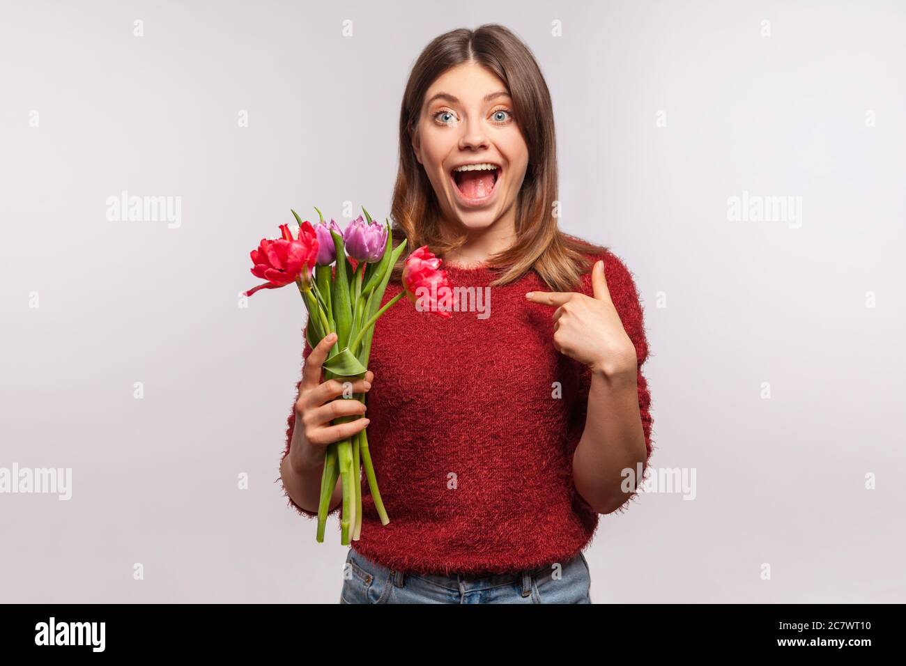 Portrait of excited surprised girl standing with open mouth, showing ...