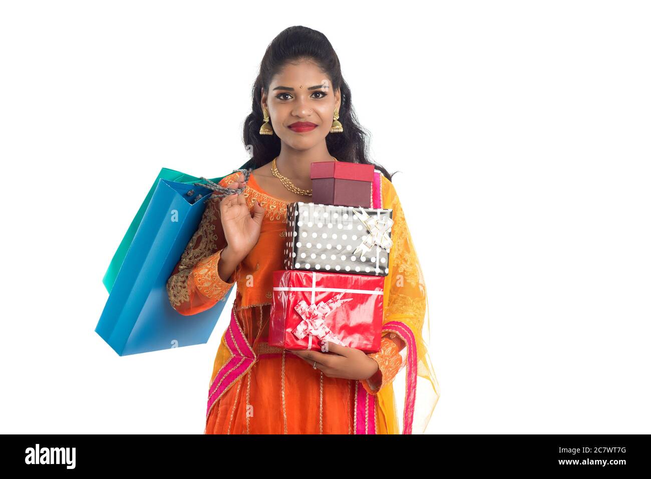 Beautiful woman carrying many shopping bags and gift Box on a white ...