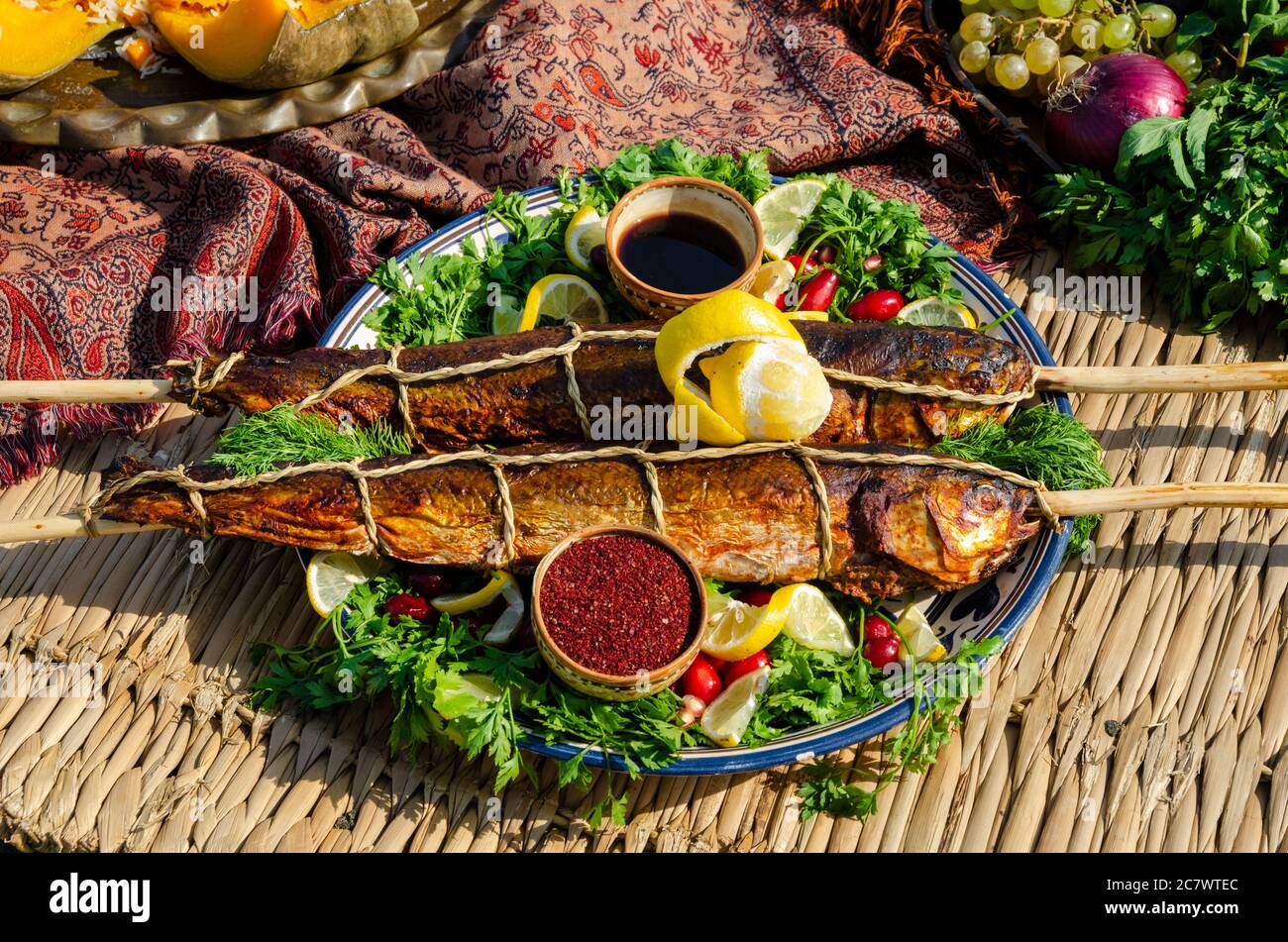 Grilled fish with herbs and sauces Stock Photo - Alamy