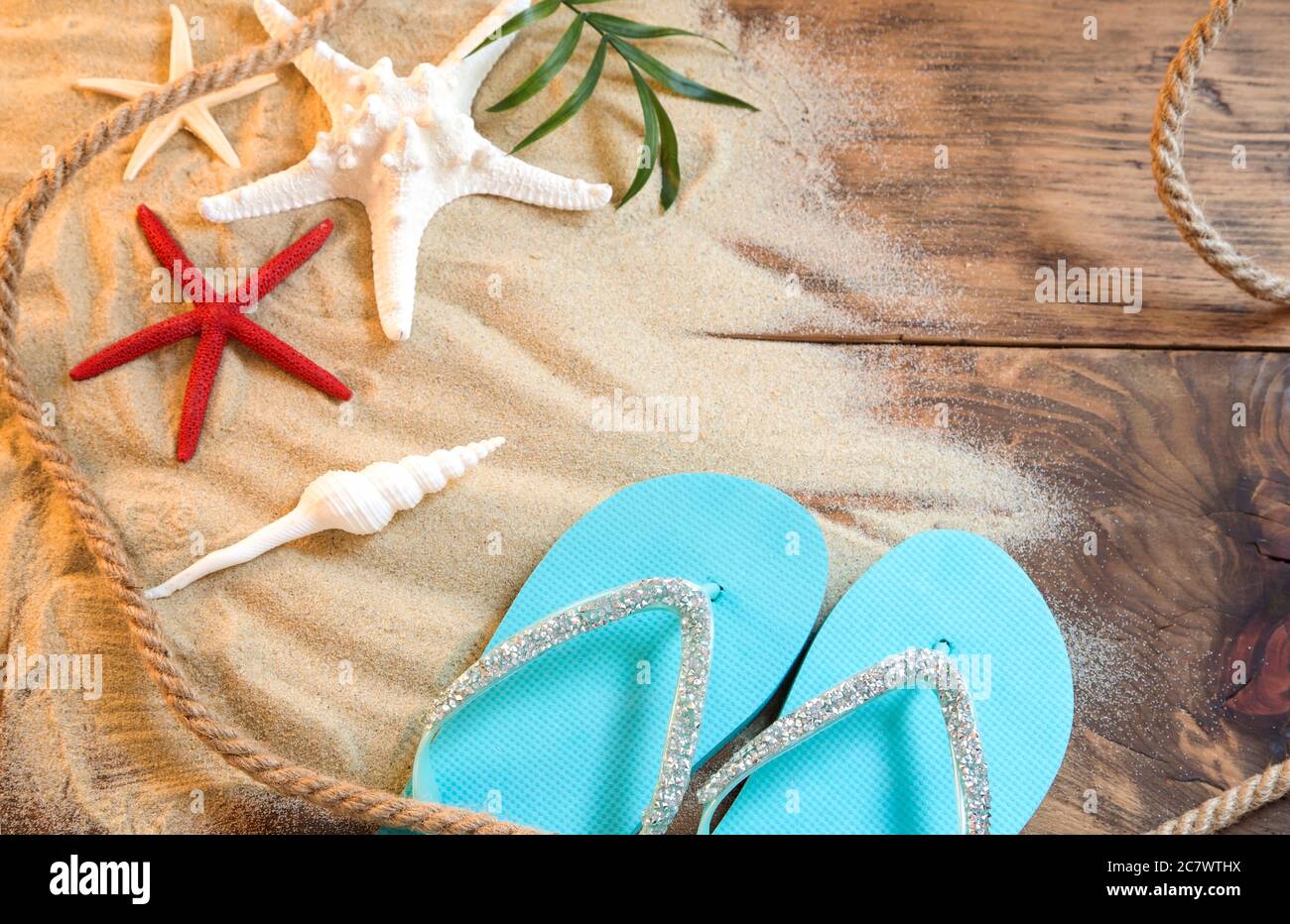Summer background with seashells and slippers Stock Photo - Alamy