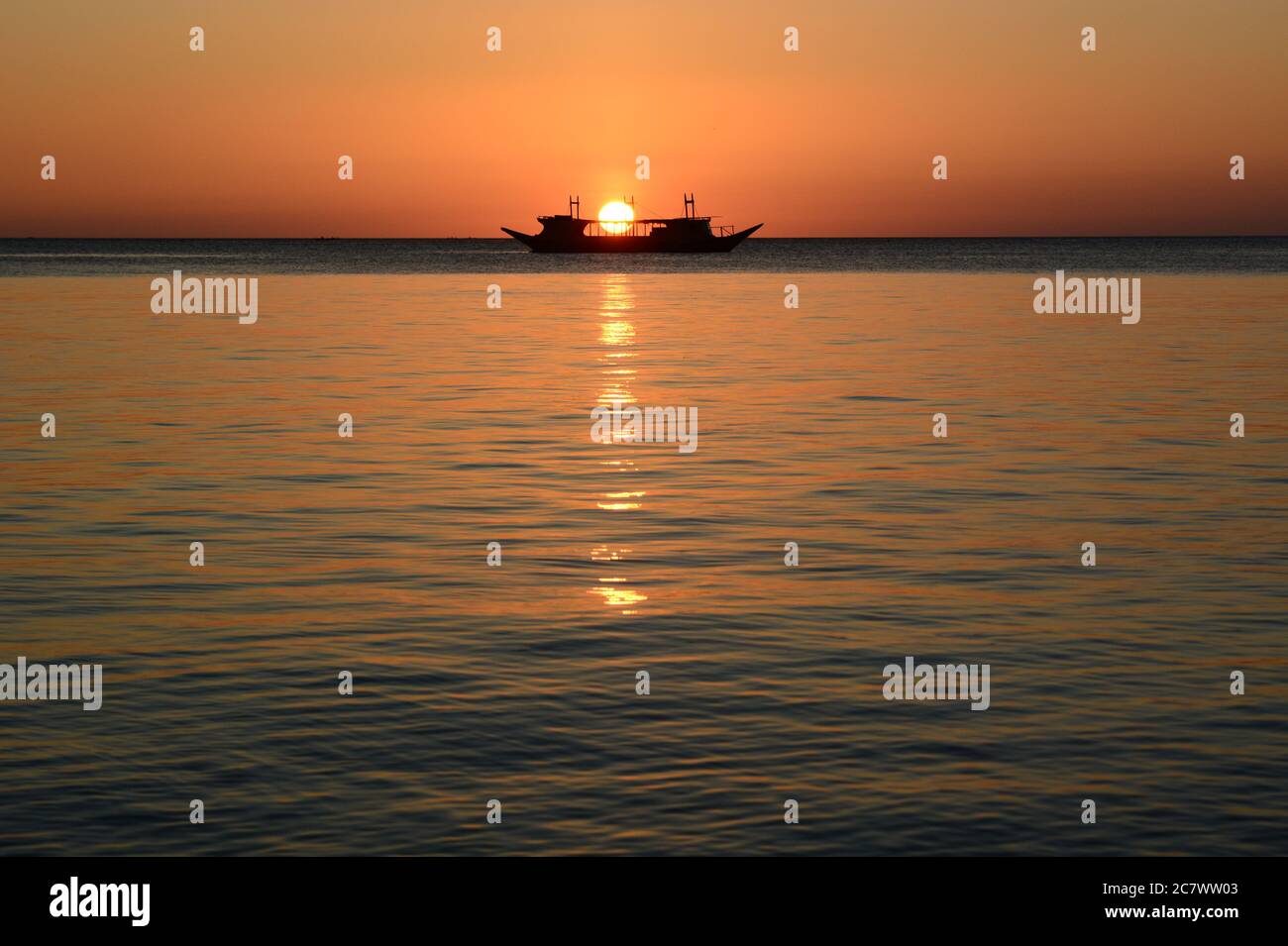 Sunset over a local boat. White Beach. Boracay. Aklan. Western Visayas ...