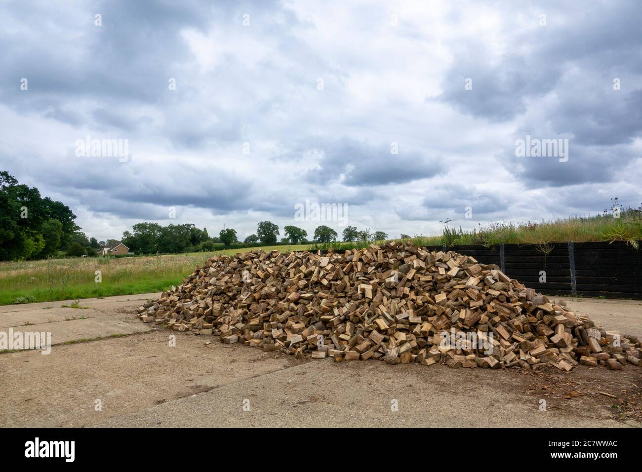 Log pile on farm, wood Stock Photo - Alamy