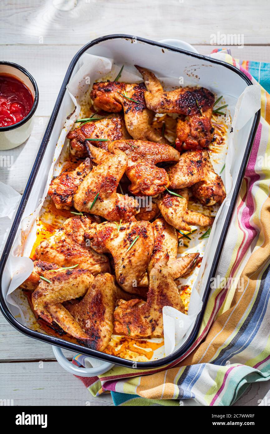 Top view of roasted chicken wings with barbecue sauce Stock Photo - Alamy