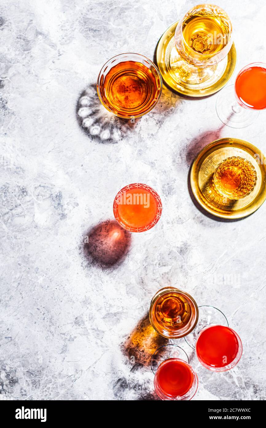 Vertical high angle shot of glasses filled with different drinks on a ...