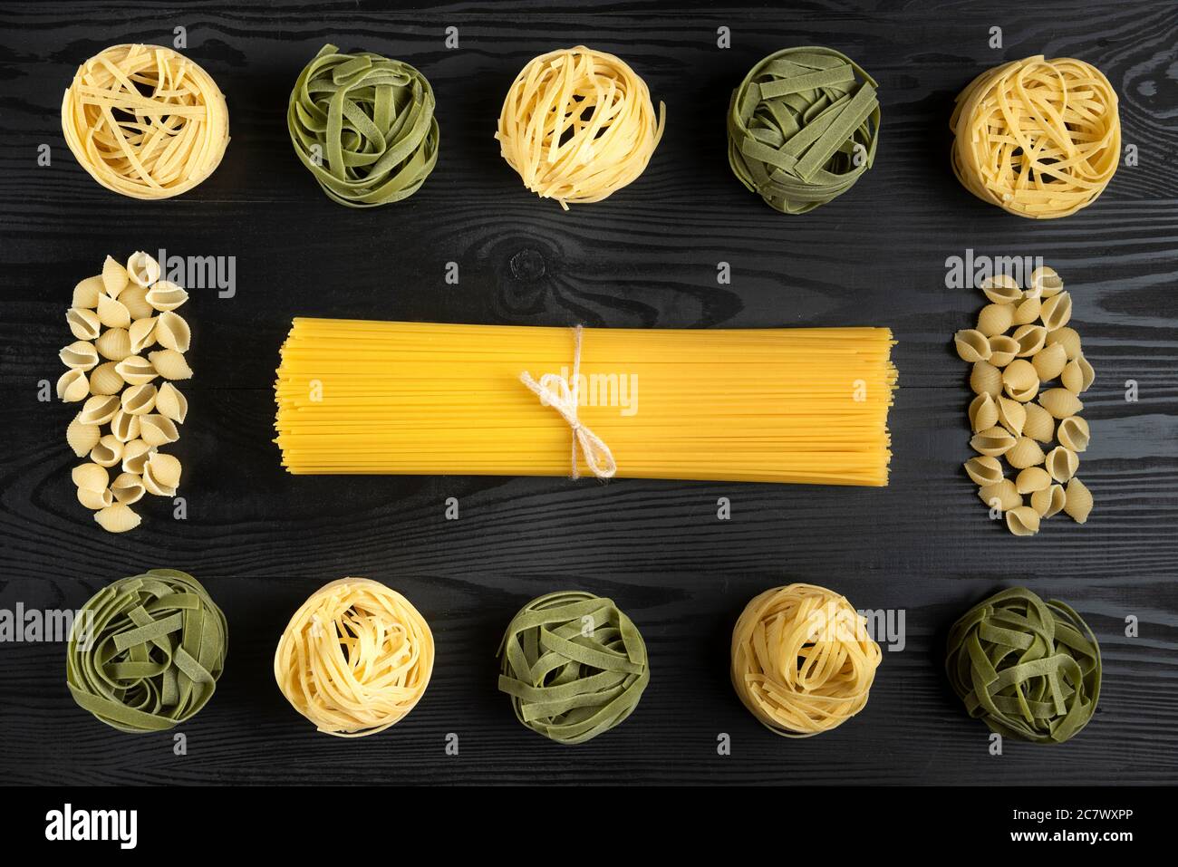 Italian pasta varieties on the black table Stock Photo - Alamy