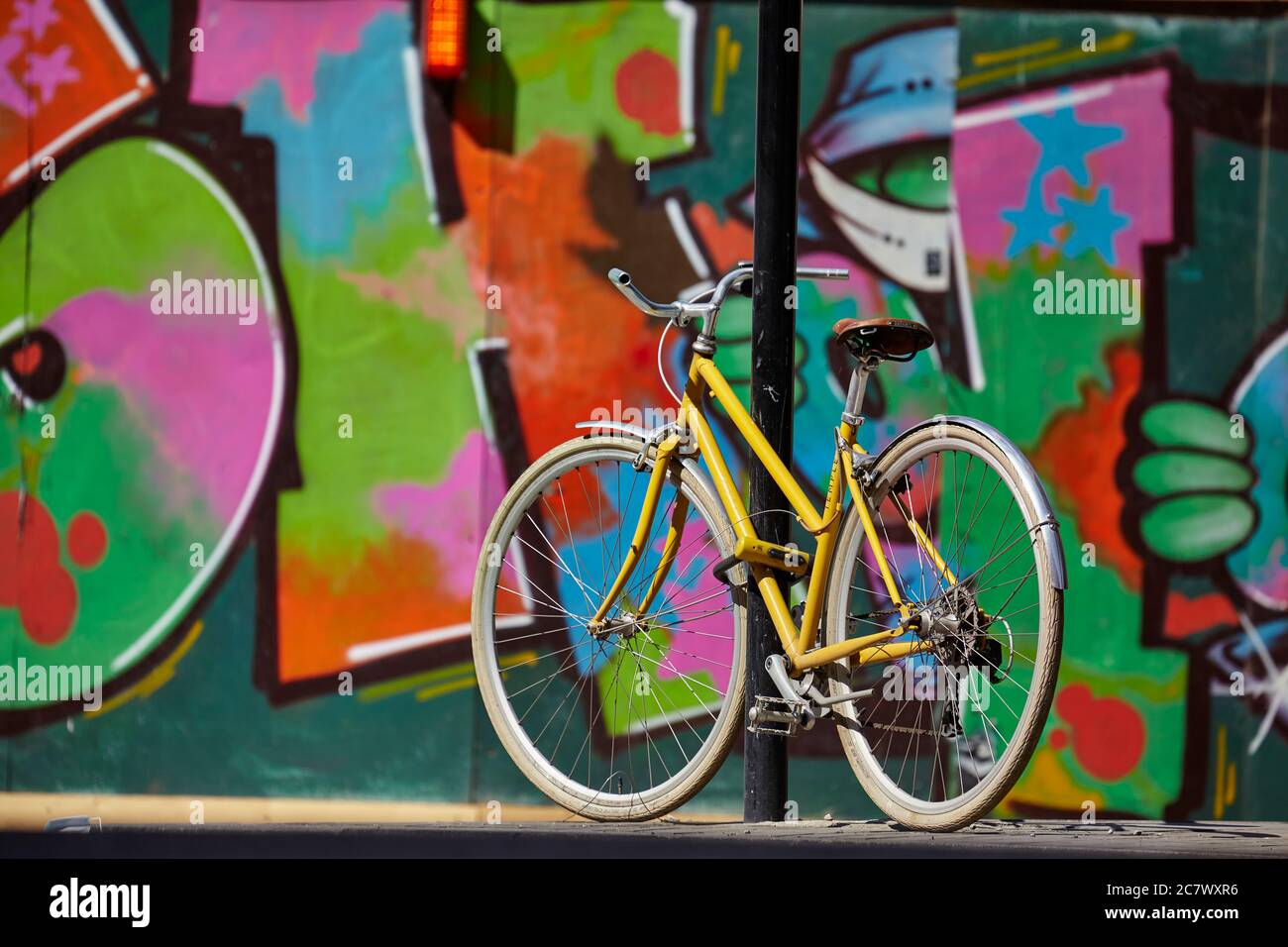 Yellow Bicycle against colourful background, London, UK Stock Photo - Alamy