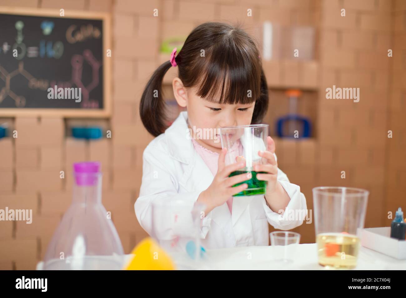 toddler girl play science experiments for homeschooling Stock Photo - Alamy
