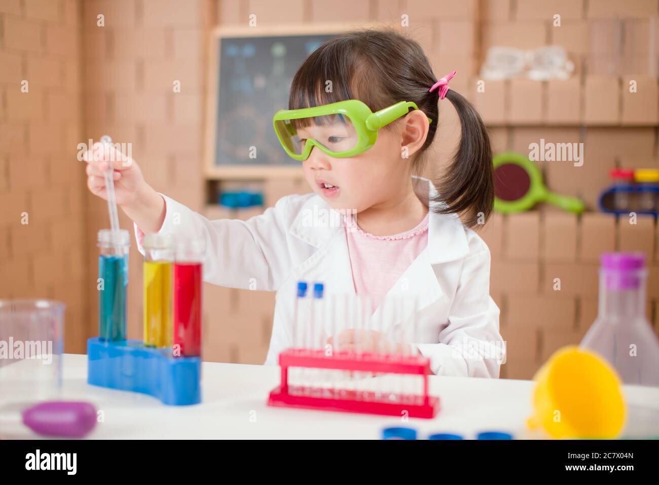 toddler girl play science experiments for homeschooling Stock Photo - Alamy