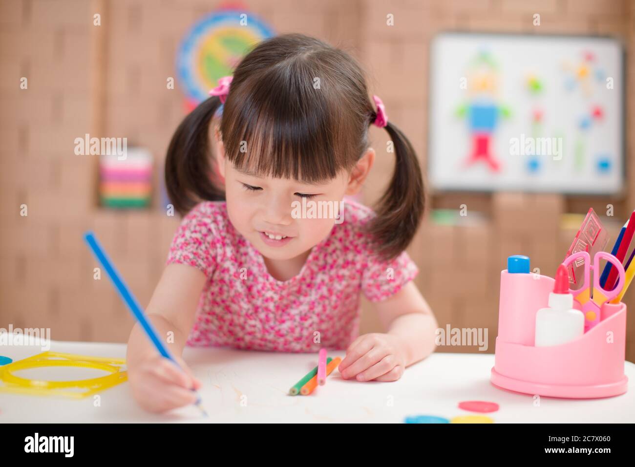 toddler girl practice drawing different shapes for homeschooling Stock ...