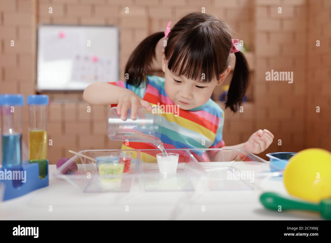 toddler girl play science experiments for homeschooling Stock Photo - Alamy