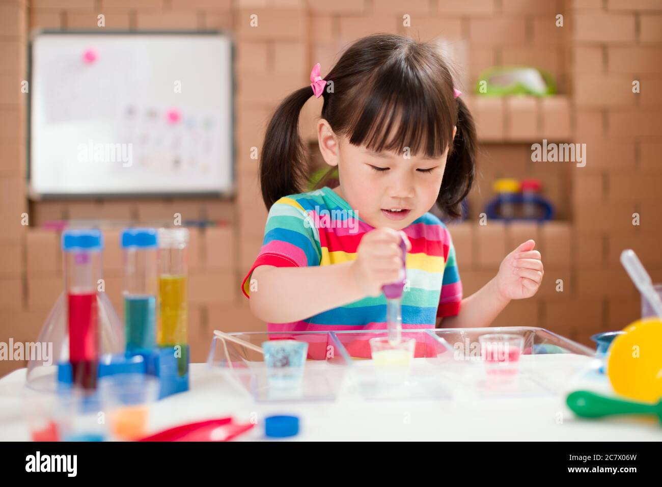 toddler girl play science experiments for homeschooling Stock Photo - Alamy