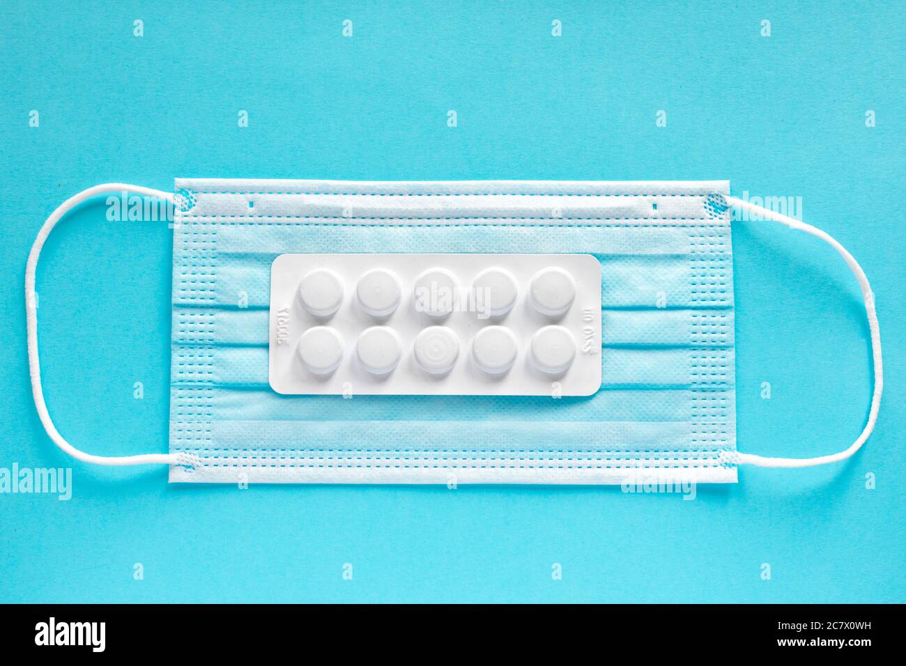 Health care prevention medical tablets pills on face mask stock photo ...