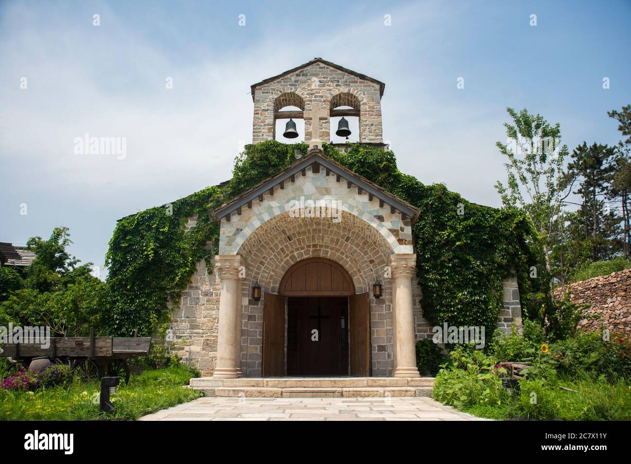Medieval church building with two ringing bells on the top Stock Photo ...