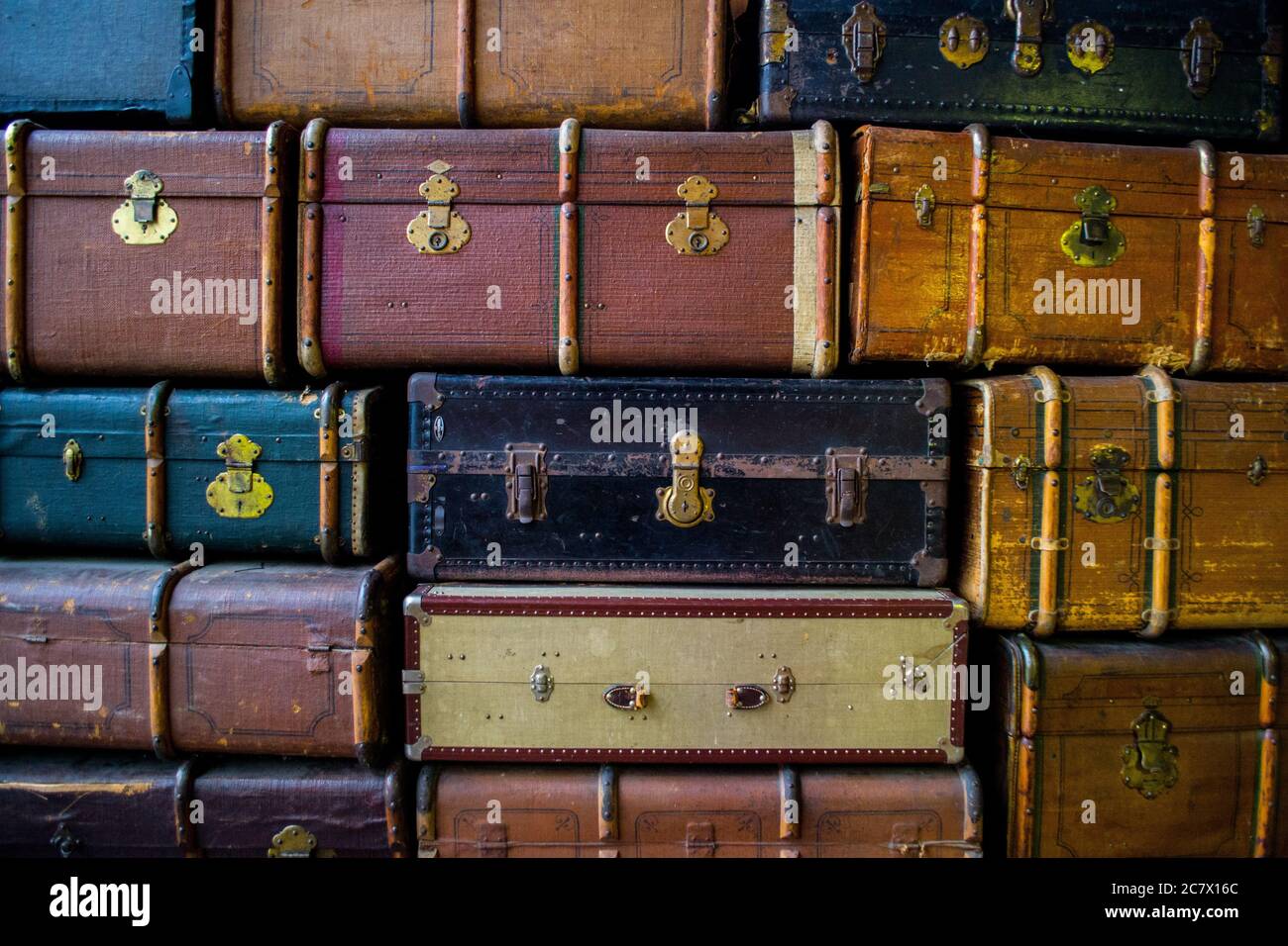 Old and weathered colourful retro suitcases Stock Photo - Alamy