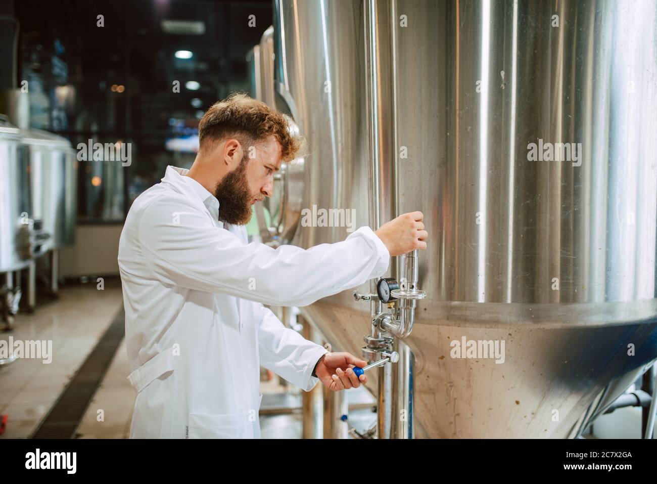 Professional caucasian technologist expert controlling industrial ...