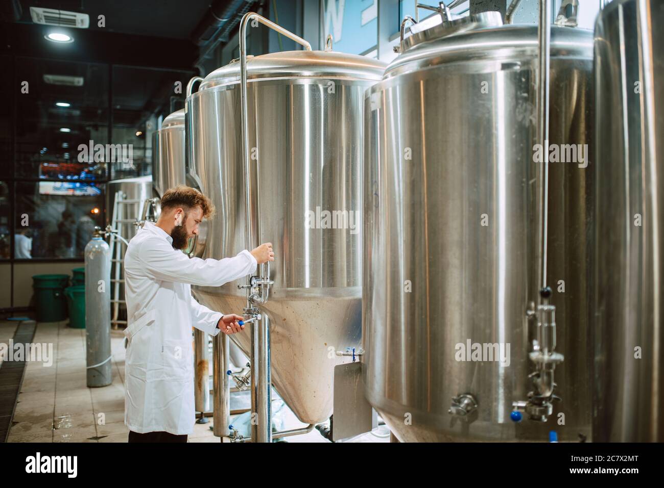 Professional caucasian technologist expert controlling industrial ...