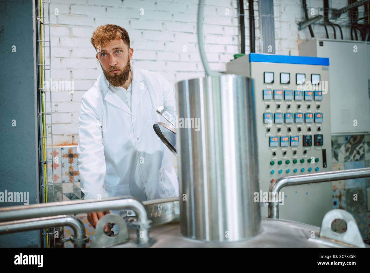 Professional caucasian technologist expert controlling industrial ...