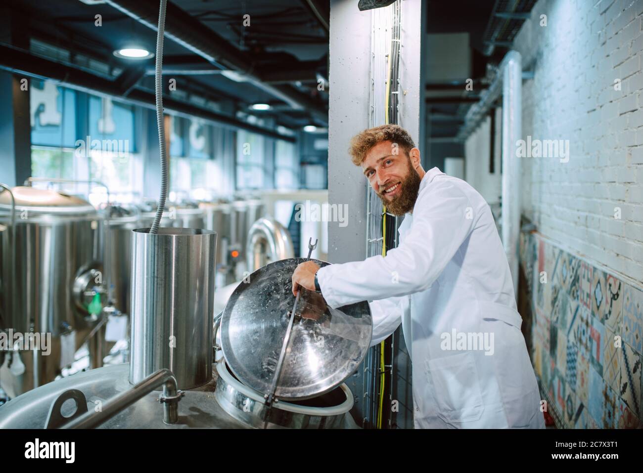 Professional caucasian technologist expert controlling industrial ...