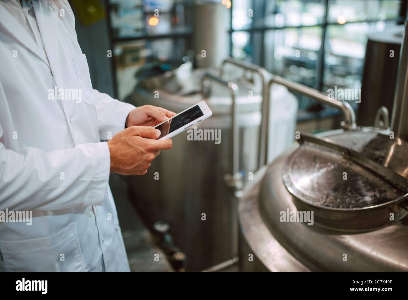 Closeup of tablet computer in hand of professional caucasian ...