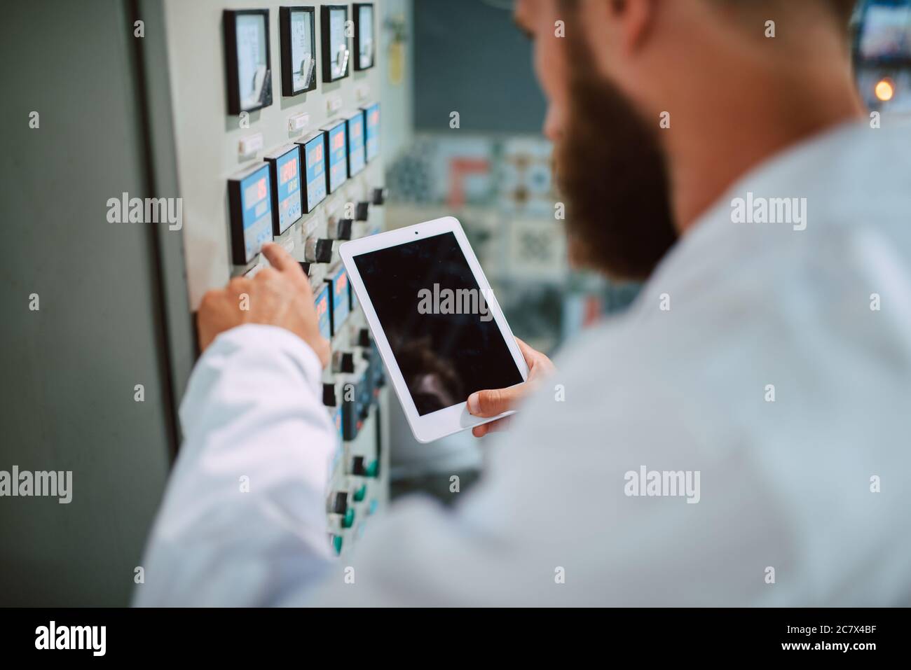 Closeup of tablet computer in hand of professional caucasian ...