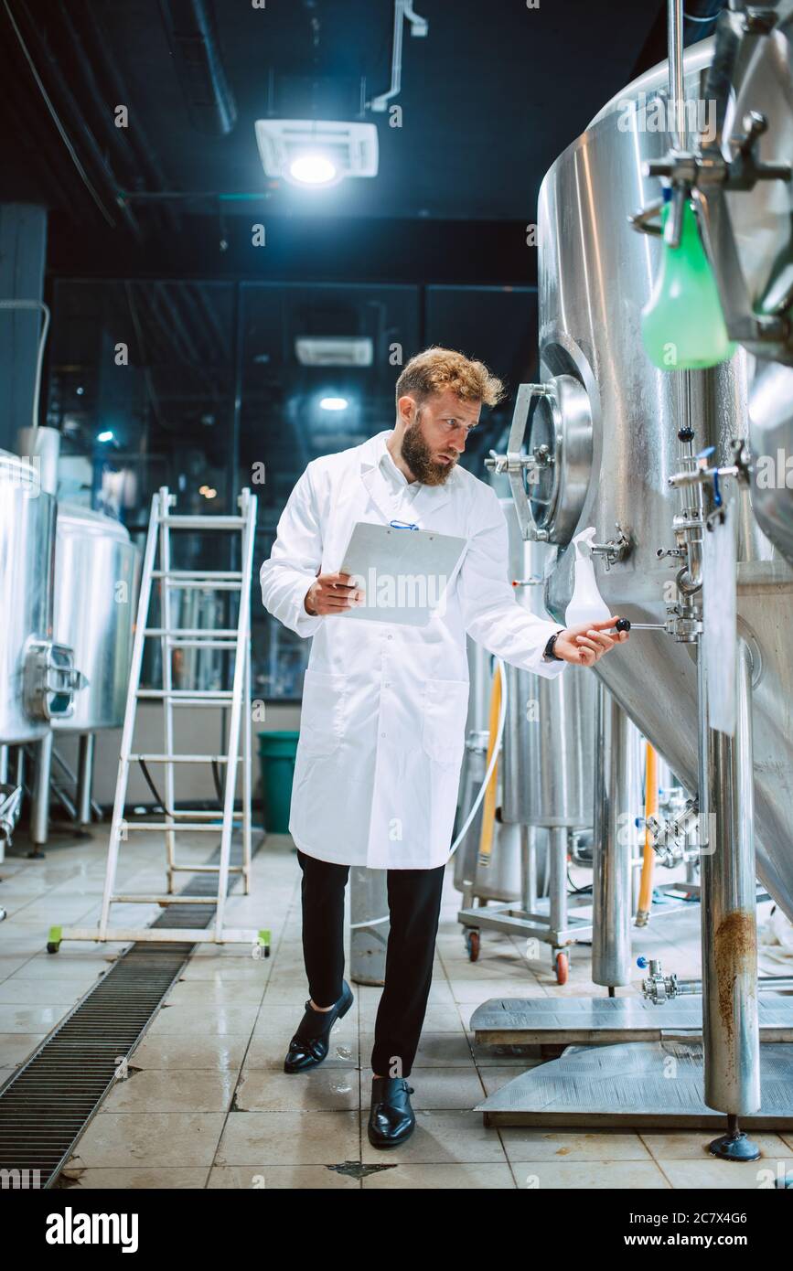 Full lenght of caucasian male professional technologist expert in white ...