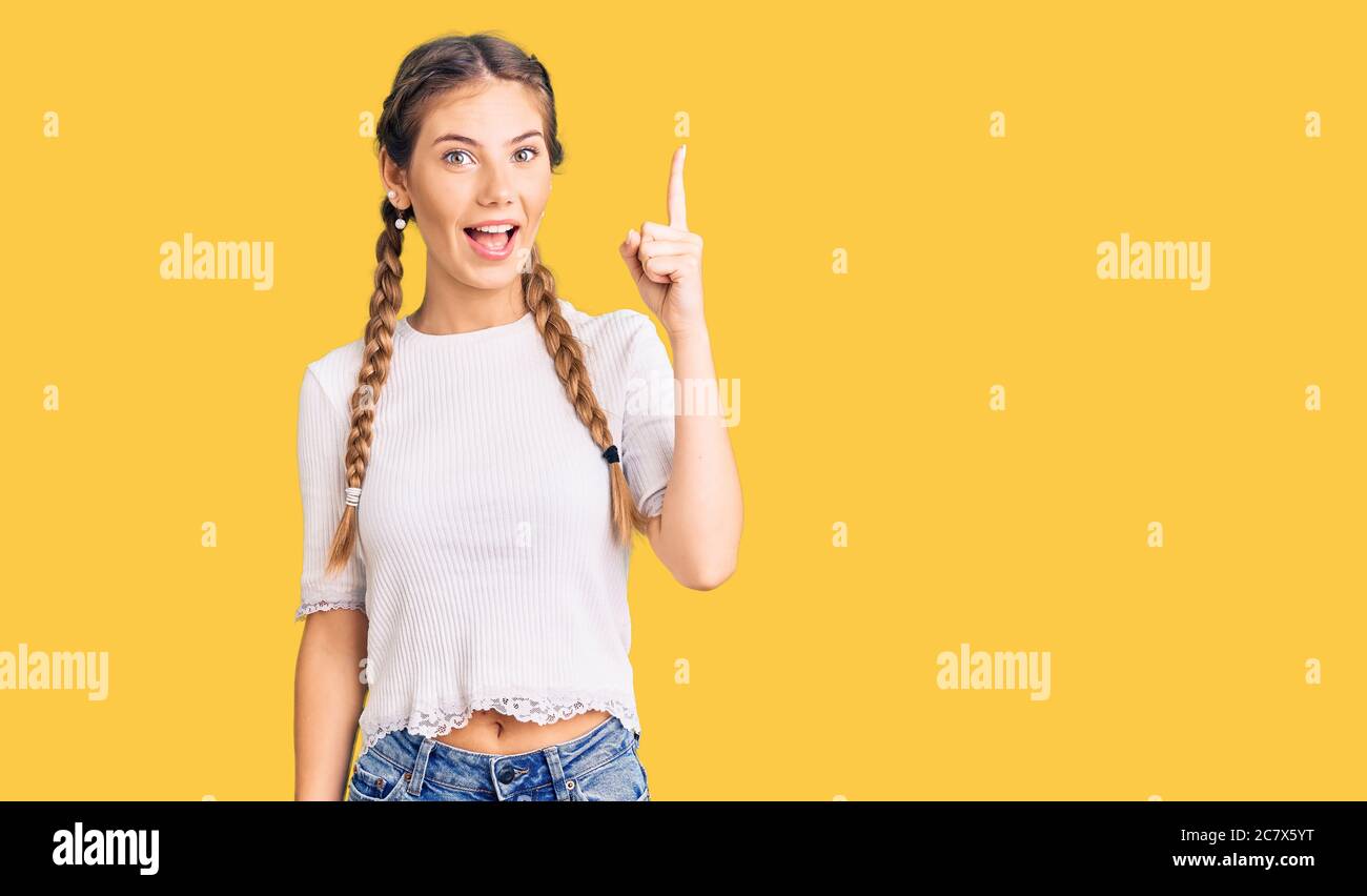 Beautiful Caucasian Woman With Blonde Hair Wearing Braids And White