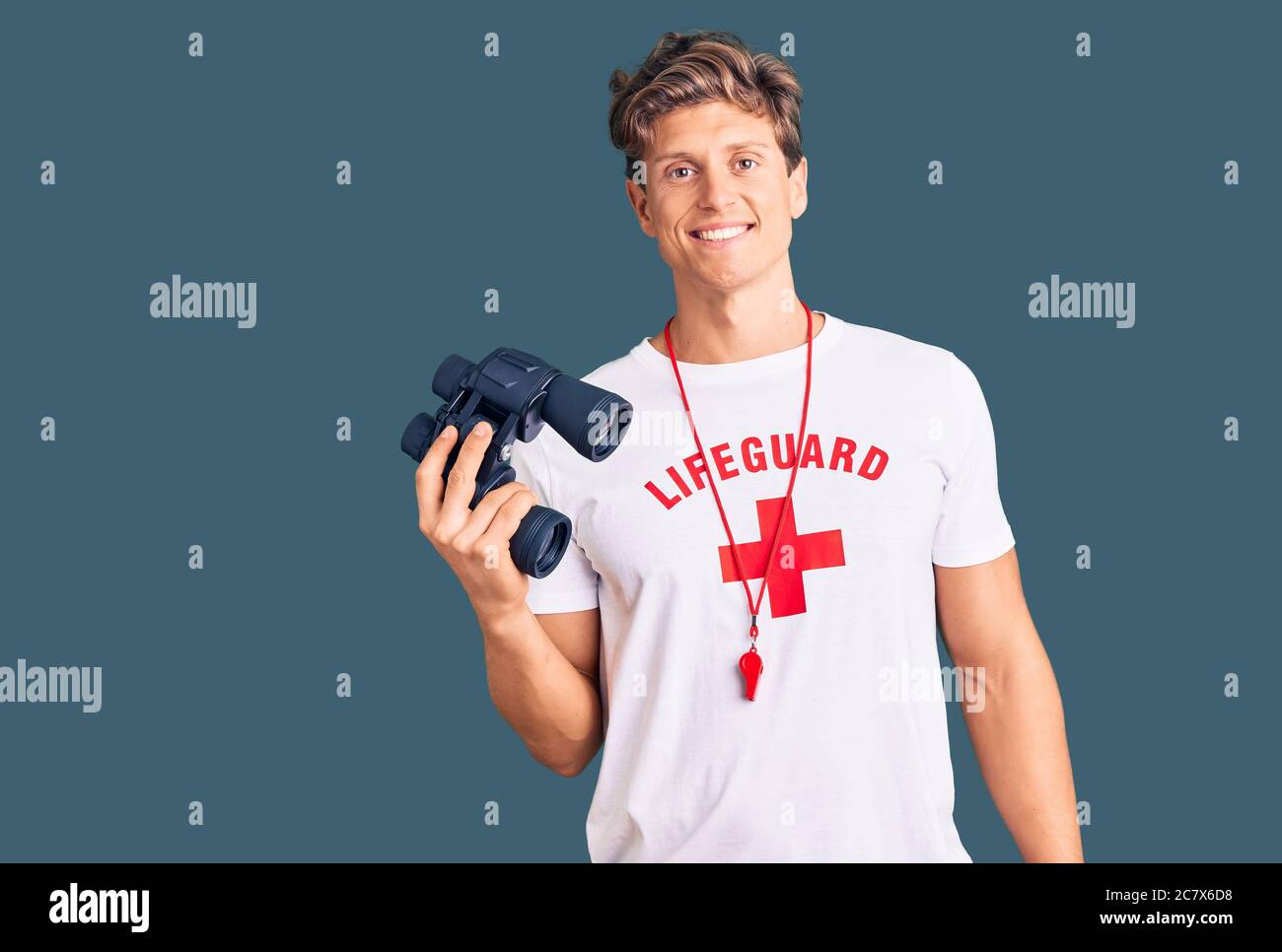 Man wearing lifeguard shirt standing hi-res stock photography and ...
