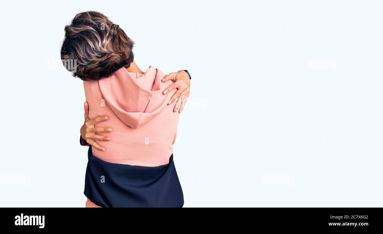 Woman hugging self back hi-res stock photography and images - Alamy