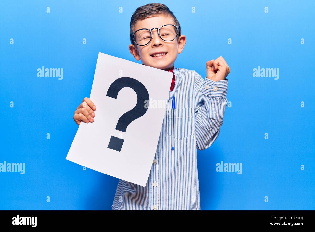 Cute blond kid wearing nerd bow tie and glasses holding question mark ...