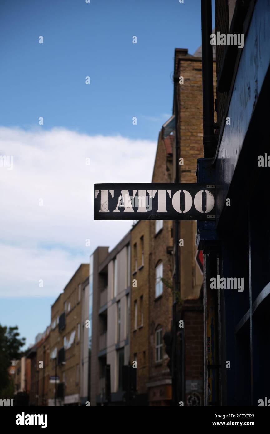 Close-up of a tattoo shop sign Stock Photo - Alamy