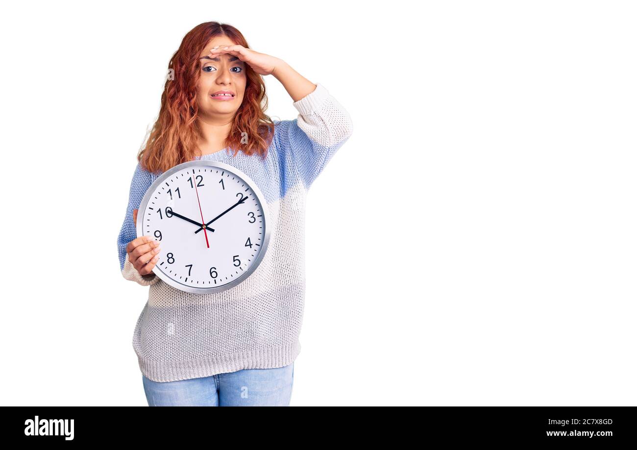 Stressed woman big clock hi-res stock photography and images - Alamy