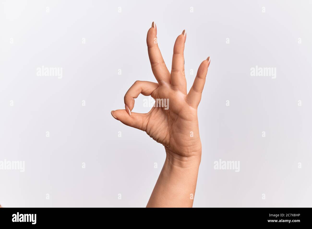 Hand of caucasian young woman gesturing approval expression doing okay ...