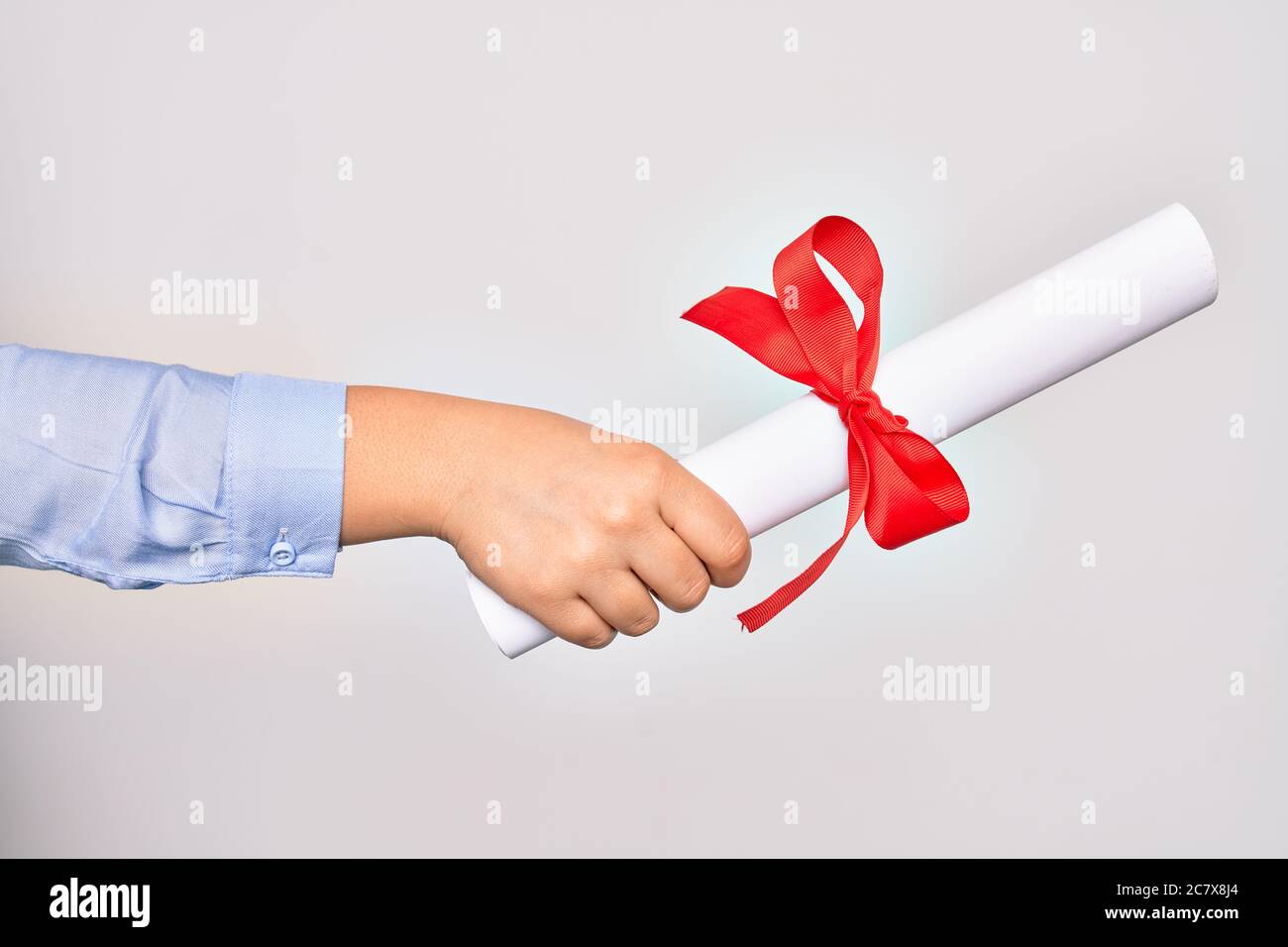 Hand of caucasian young woman holding graduated diploma degree over ...