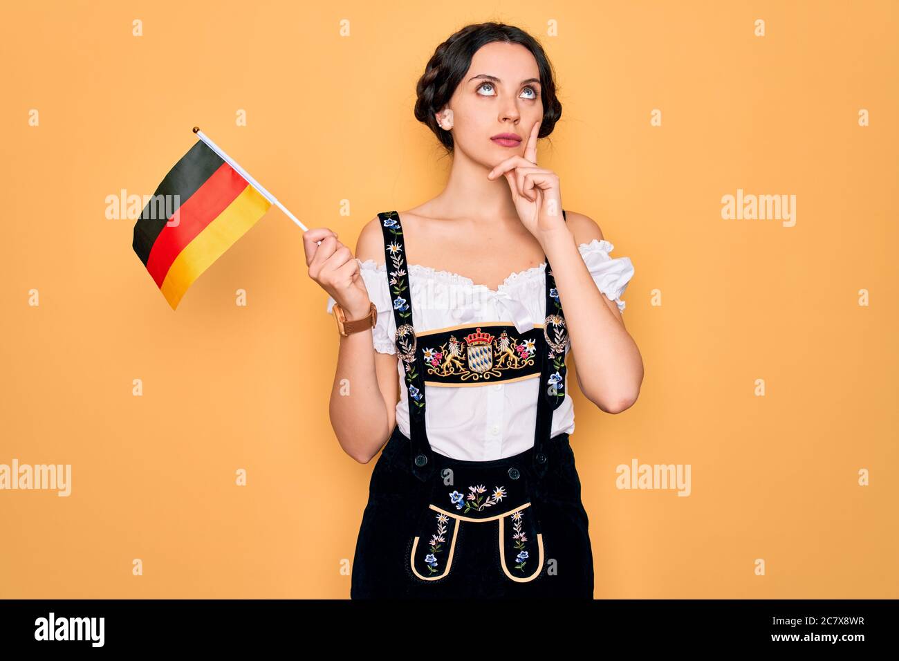 Young patriotic german woman with blue eyes wearing octoberfest dress ...