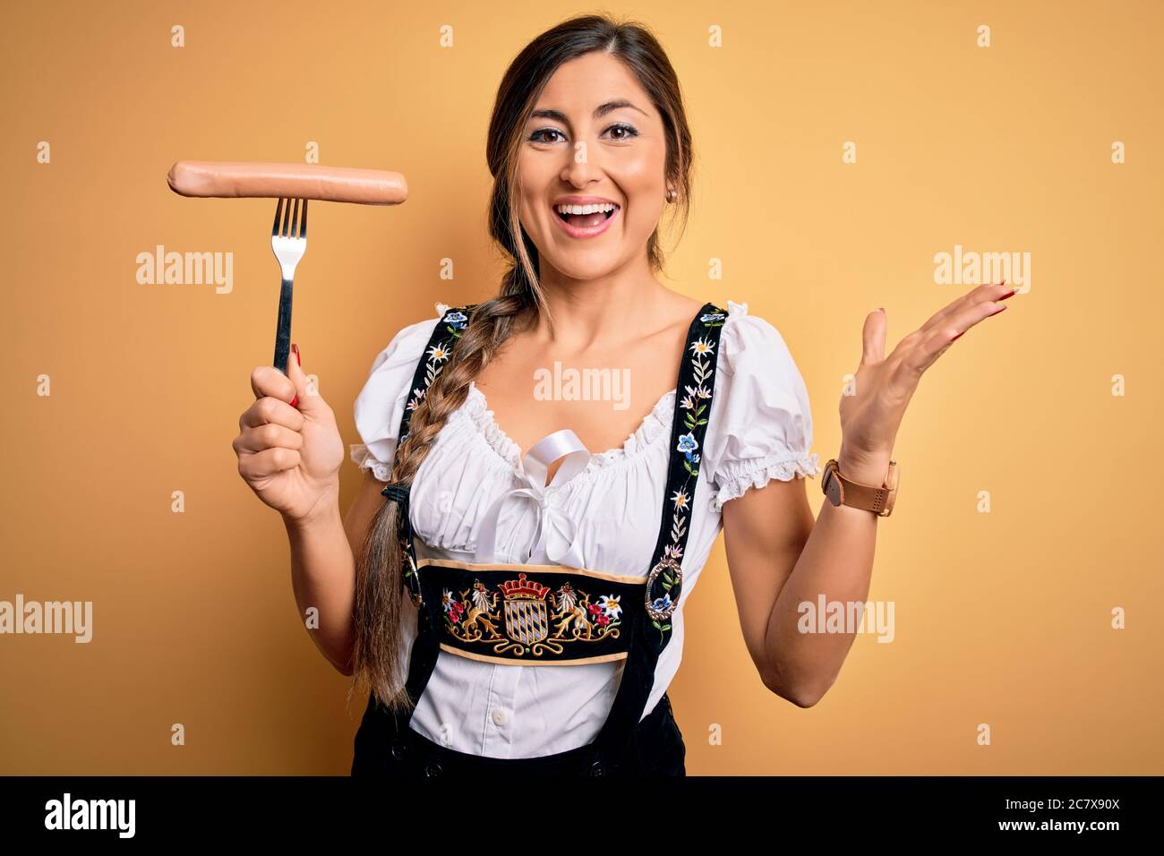 Young brunette german woman wearing traditional Octoberfest dress ...