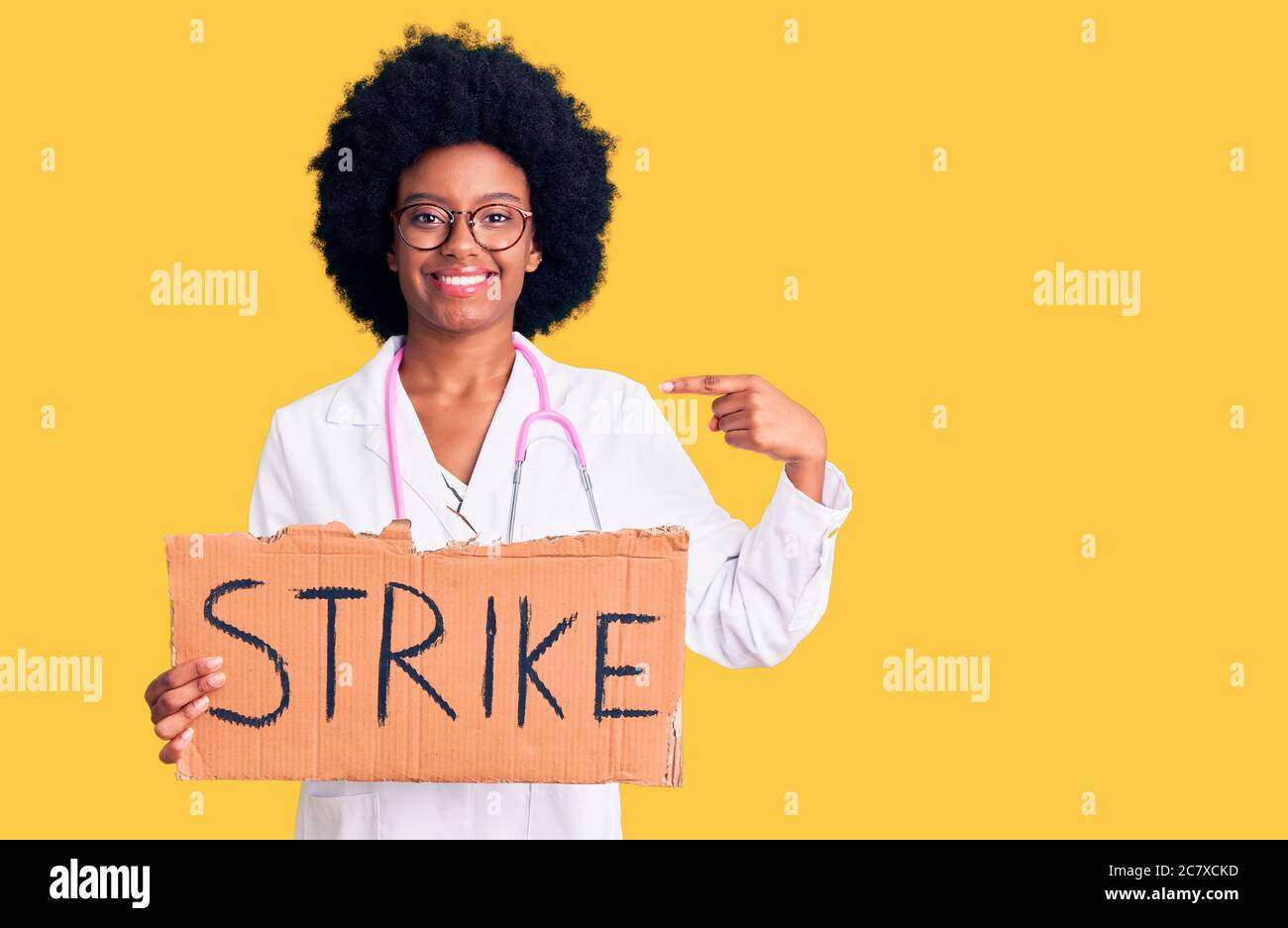 Young african american woman wearing doctor stethoscope holding strike ...